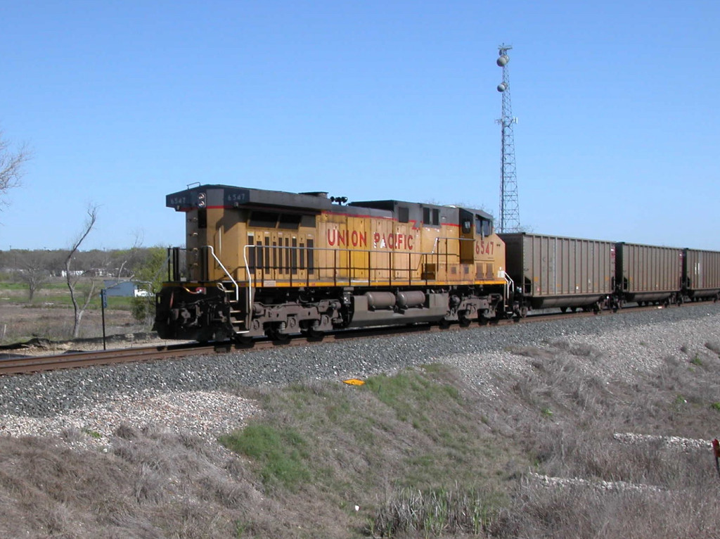 UP 6547 5Mar2012 NB on the rear at McCarty Lane with empty coal hoppers